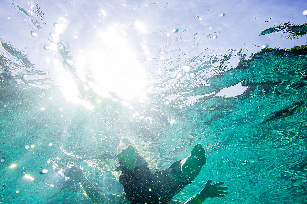 "Man In The Water Swimming" by Stocksy Contributor "Alison Winterroth ...