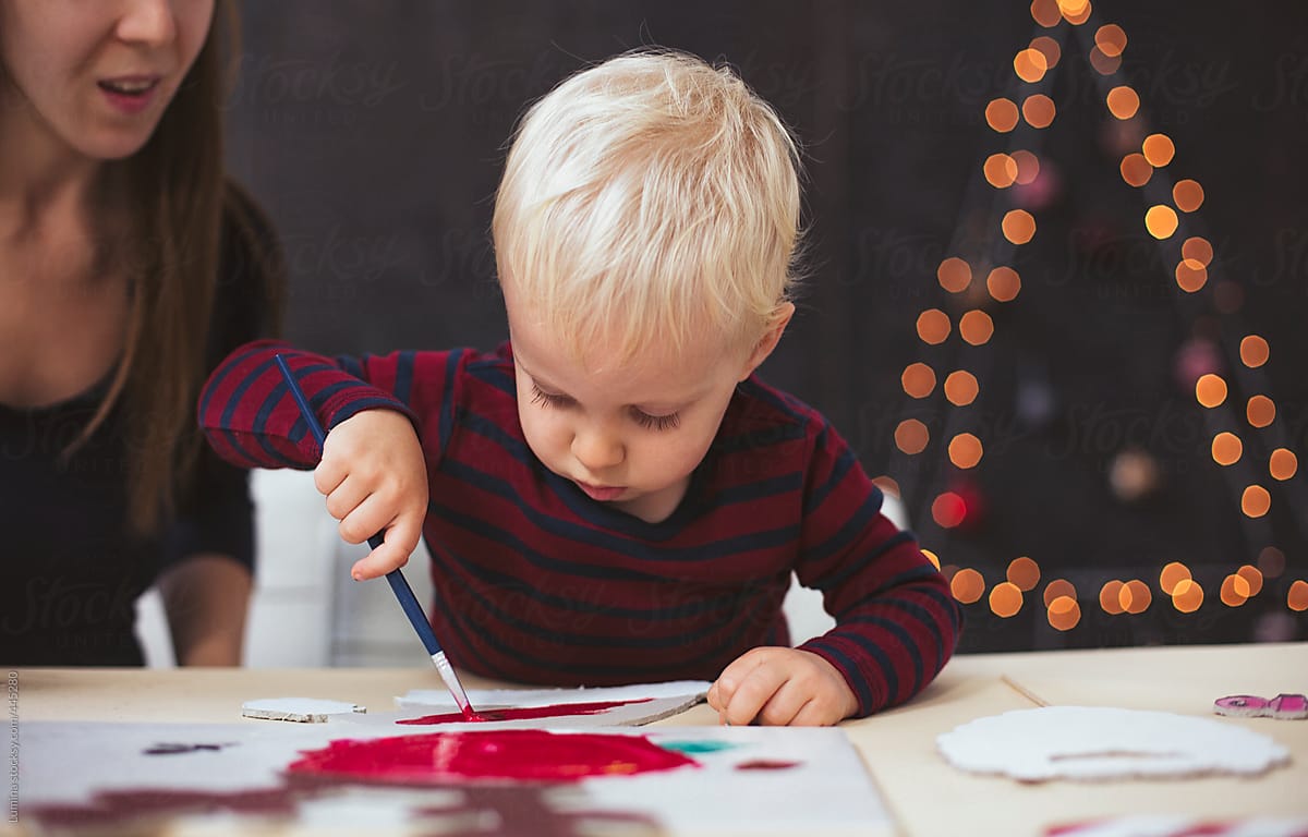 "Cute Boy Colouring Christmas Masks" by Stocksy Contributor "Lumina ...