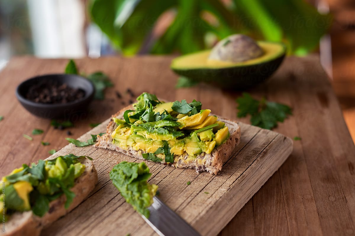 "Making Avocado Toast" by Stocksy Contributor "Gillian Vann" - Stocksy