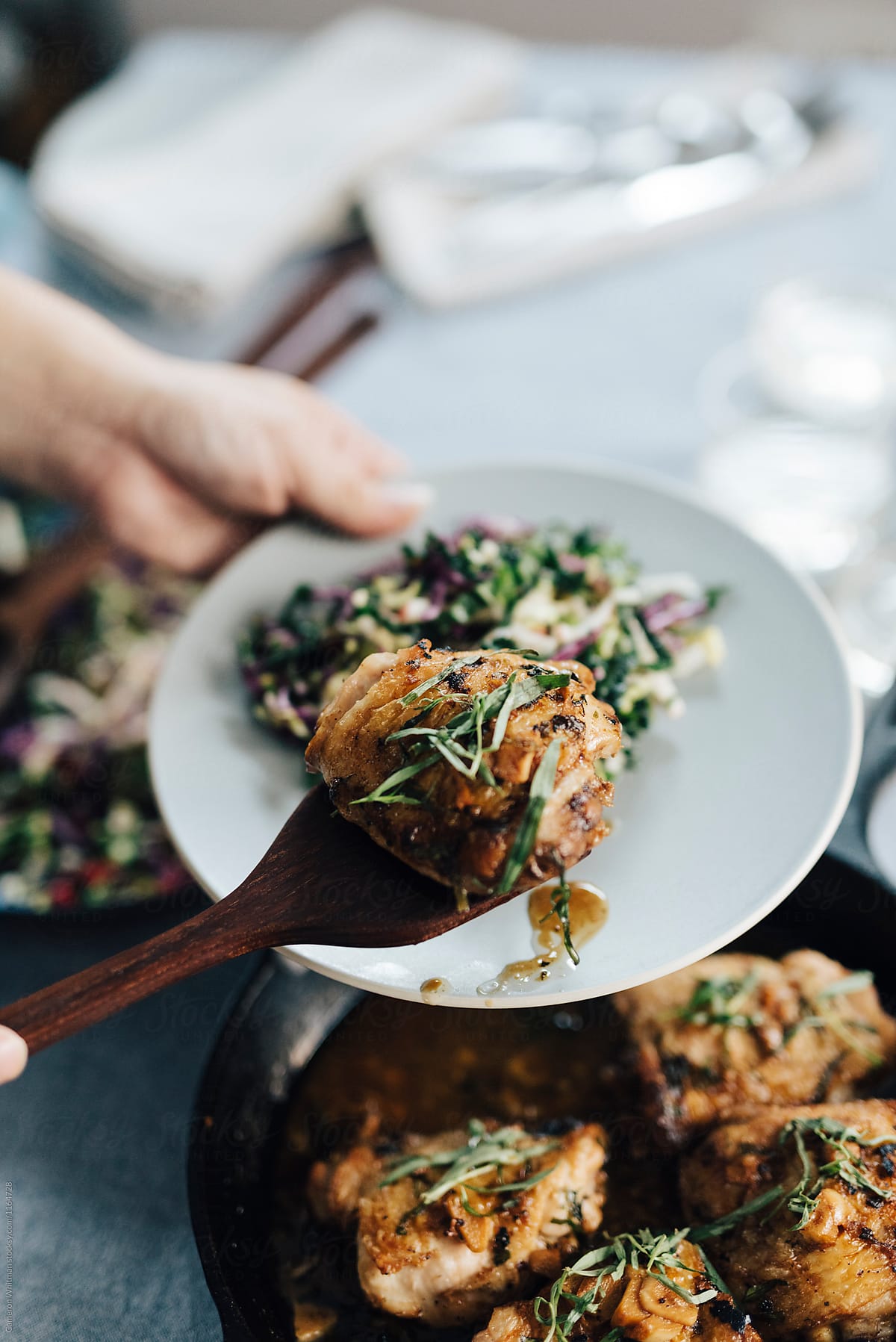 "Plating Chicken Thighs Dinner" by Stocksy Contributor "CWP, LLC" - Stocksy