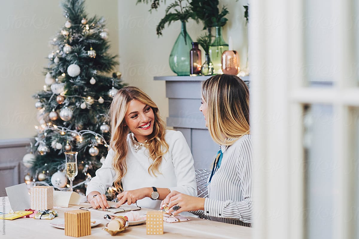 "Two Women Wrapping Christmas Presents" by Stocksy Contributor "Lumina ...