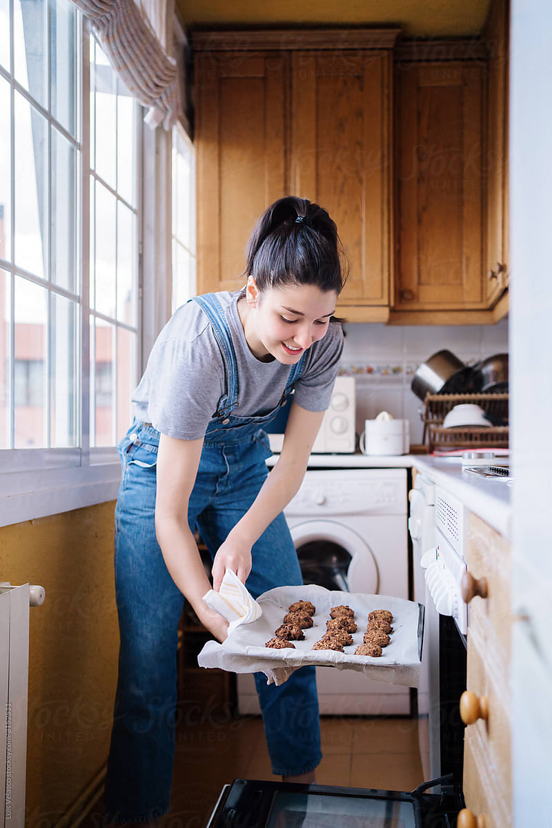 "Woman Baking Cookies At Home." by Stocksy Contributor "Luis Velasco ...