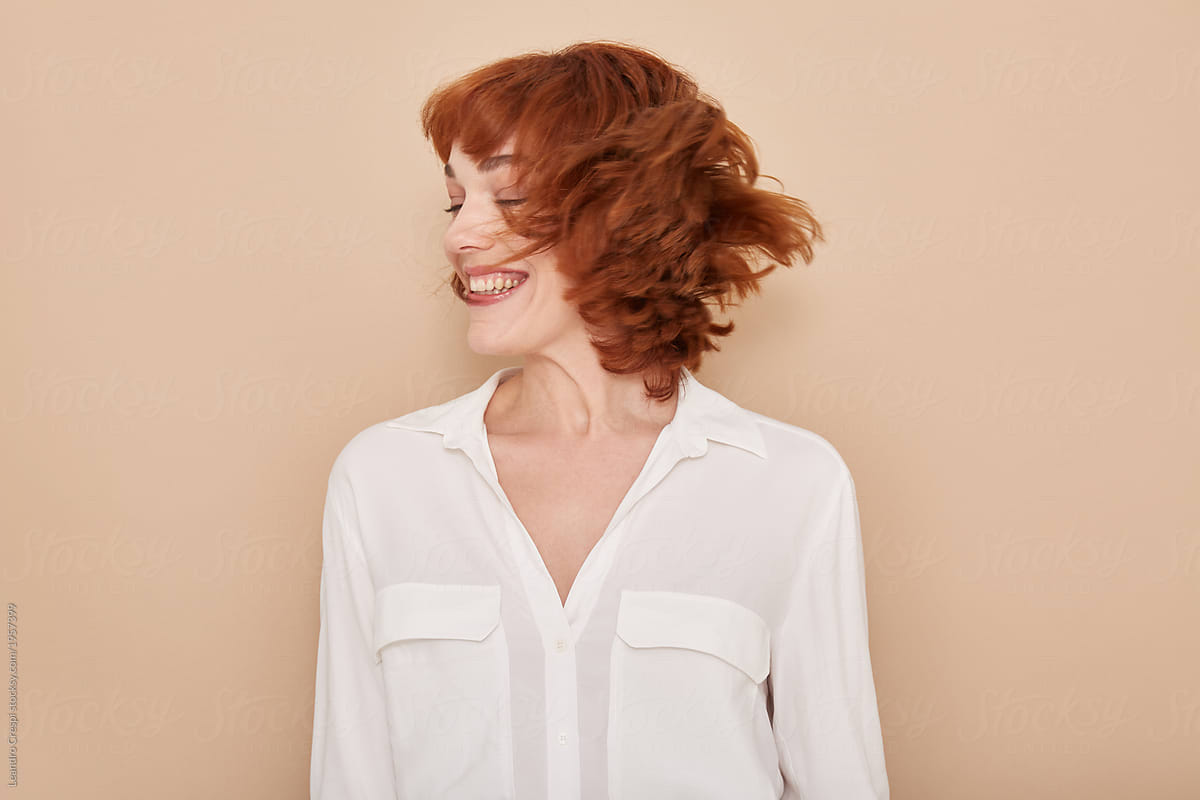"Red Haired Woman Flipping Her Hair" by Stocksy Contributor "Leandro ...