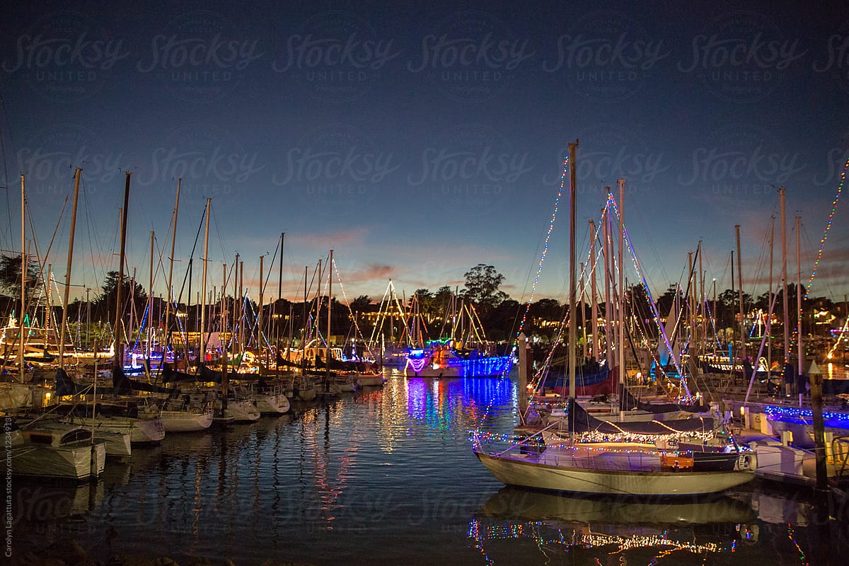 "Boats In A Harbor Decorated With Lights For Christmas" by Stocksy ...