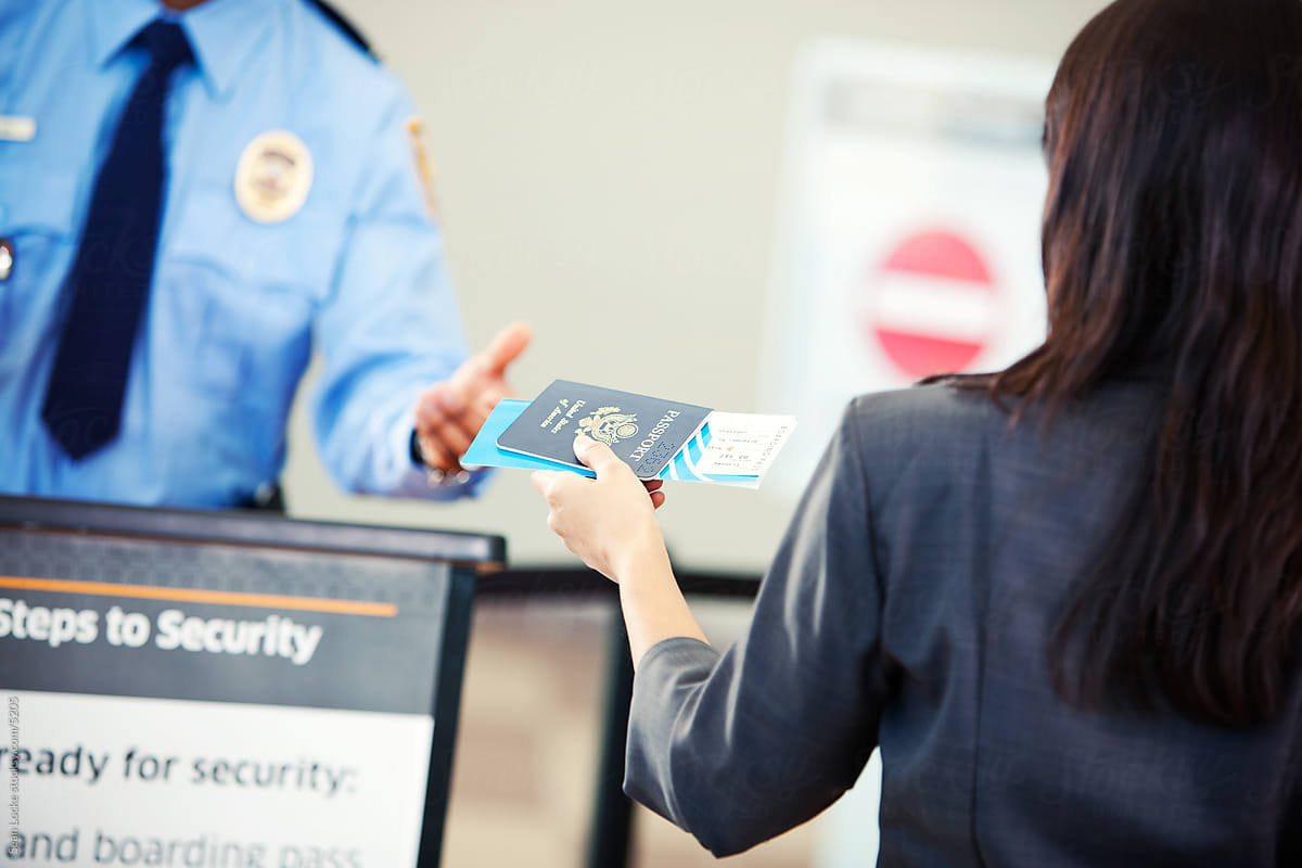 "Airport: Giving Passport And Ticket To Security" by Stocksy ...