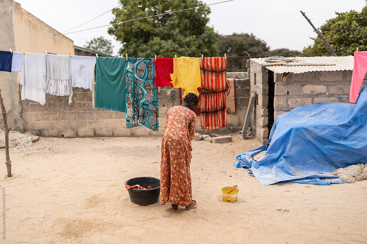"Daily Life In Senegal: Girl Hanging Laundry" by Stocksy Contributor ...