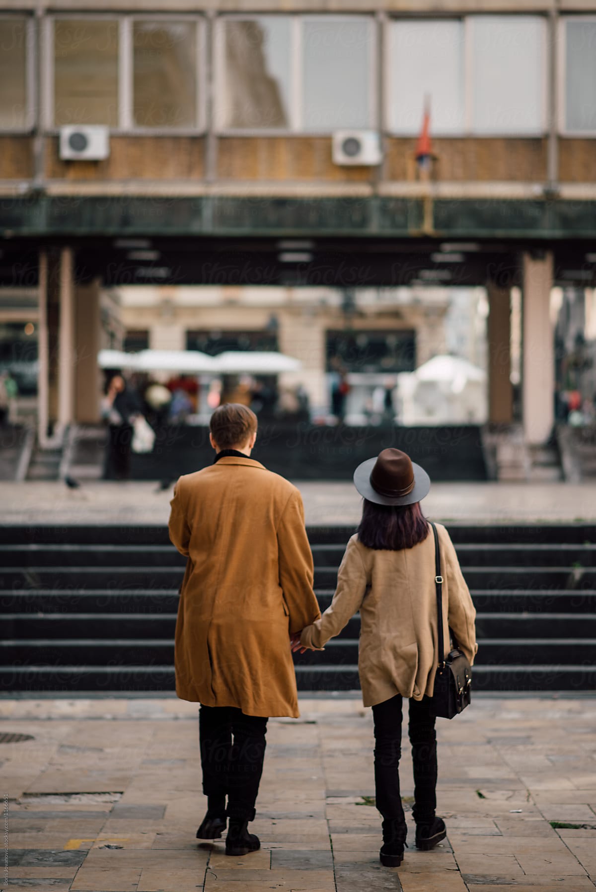 "Young Stylish Couple Walking Outdoors" by Stocksy Contributor "Boris ...