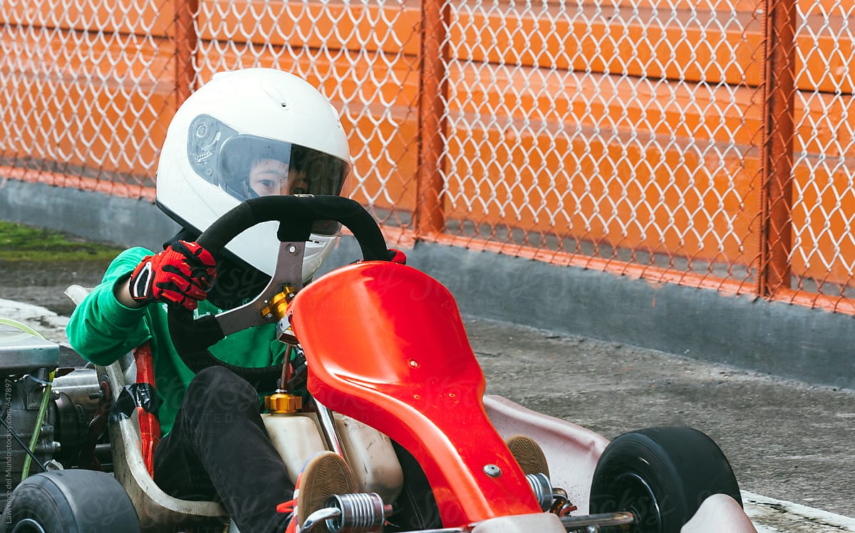 "A Young Race Kart Driver Goes Down The Pit Lane" by Stocksy ...