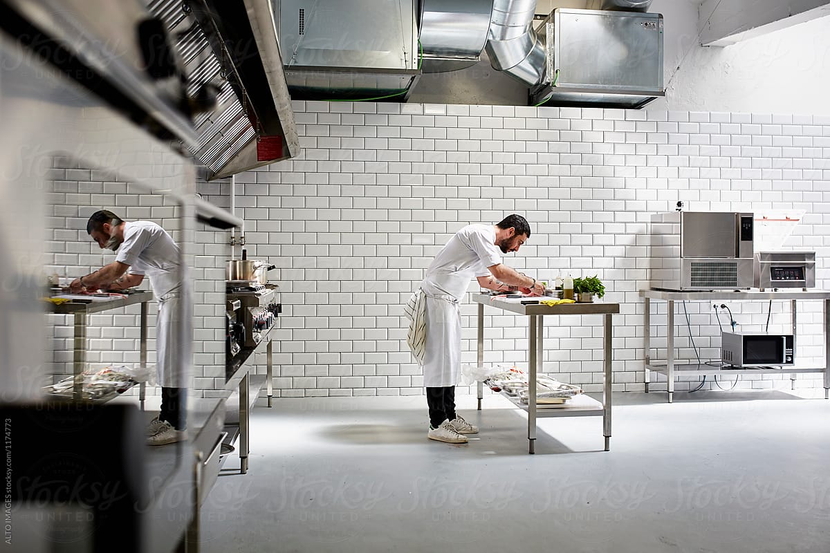"Male Chef Cooking In Commercial Kitchen" by Stocksy Contributor "ALTO ...