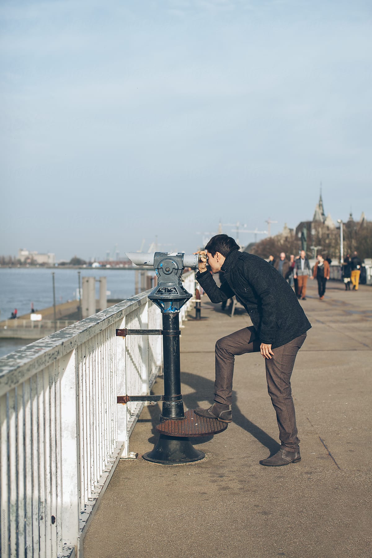"Tourist Looking Through Field Glasses" by Stocksy Contributor "Mosuno ...