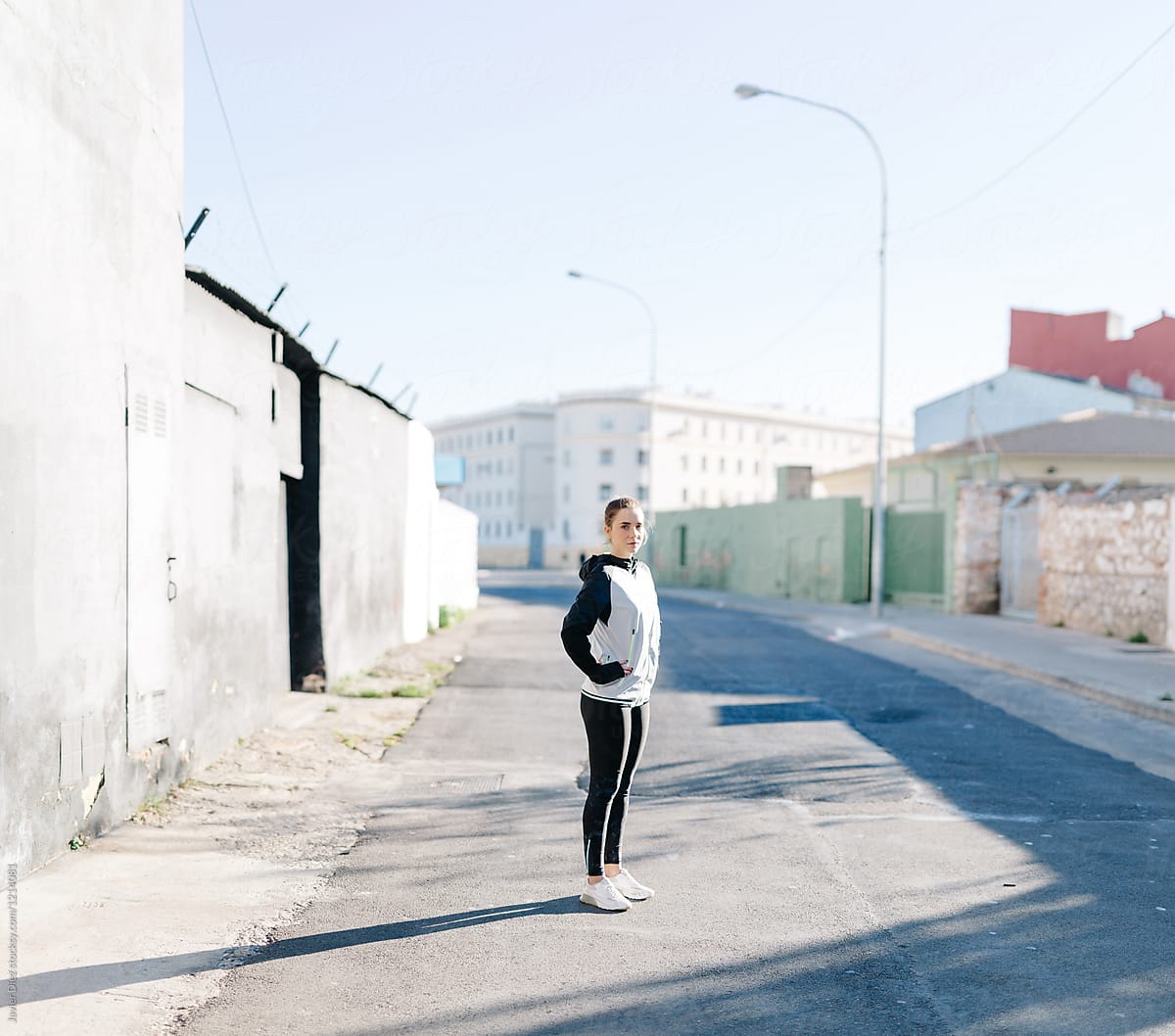 "Girl Standing In Middle Of Street" by Stocksy Contributor "Javier Díez ...
