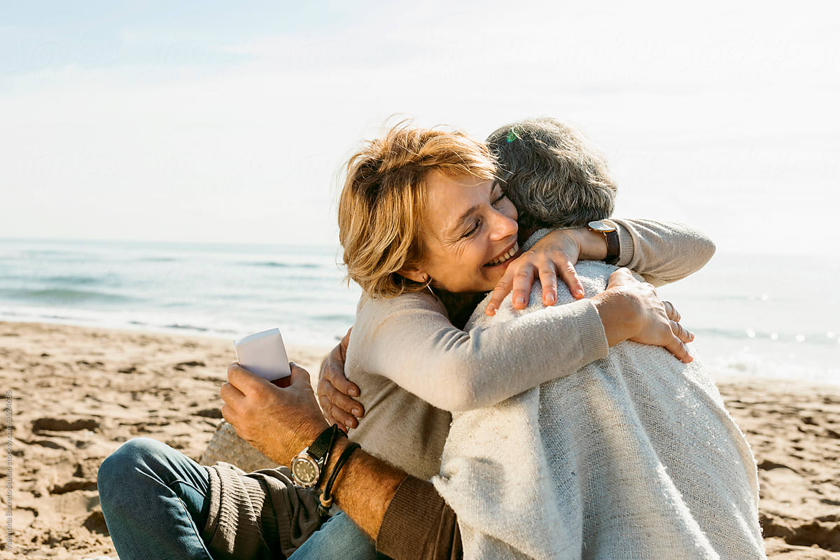 "Mature Couple Propose At The Beach" by Stocksy Contributor "Valbar ...