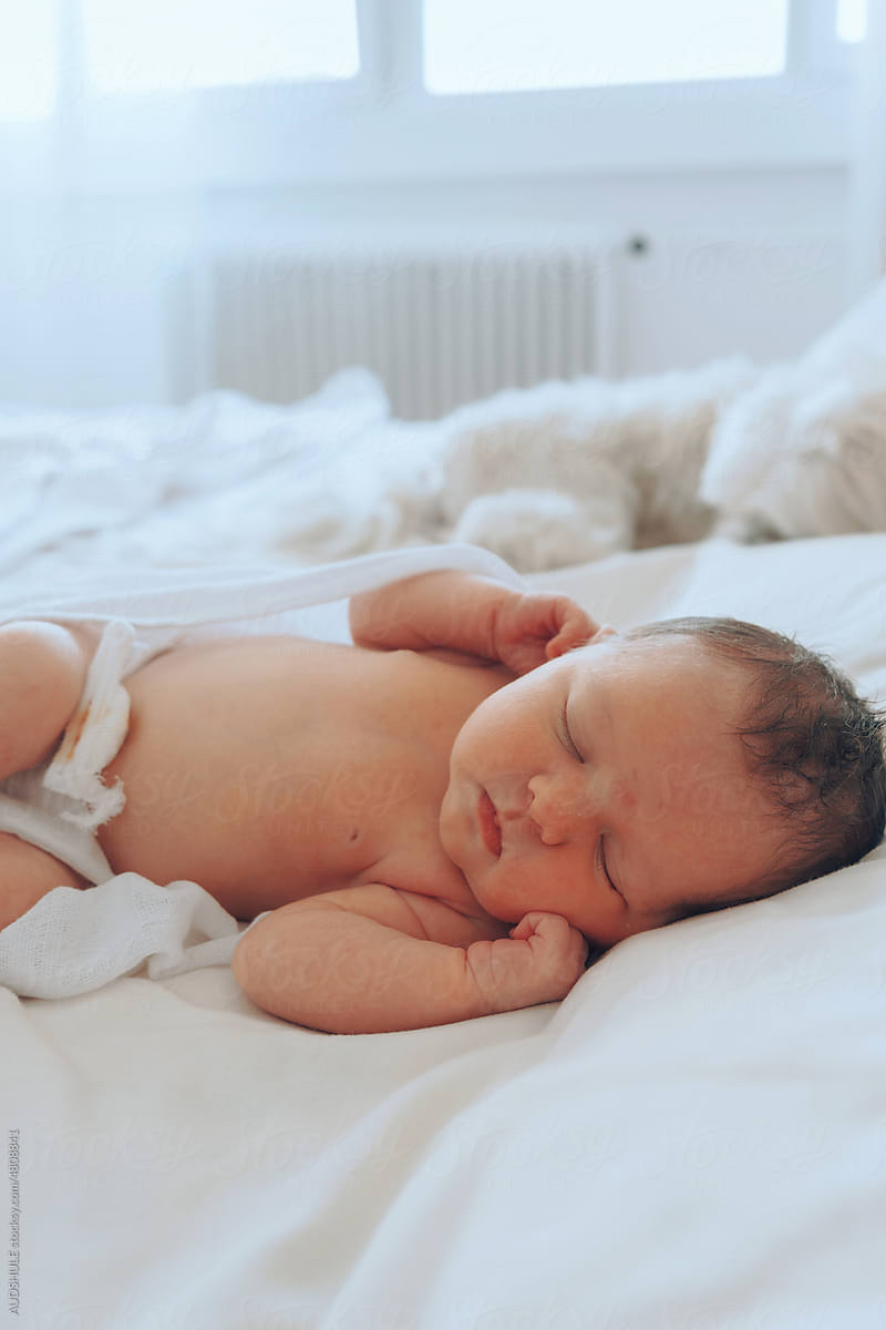 "Baby Sleeping In Diapers On White" by Stocksy Contributor "AUDSHULE ...