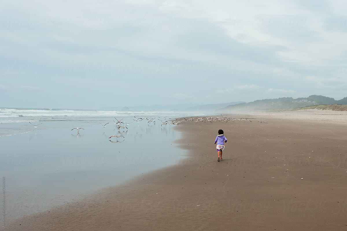 "Girl Chasing Birds At The Ocean" by Stocksy Contributor "Justin Mullet ...