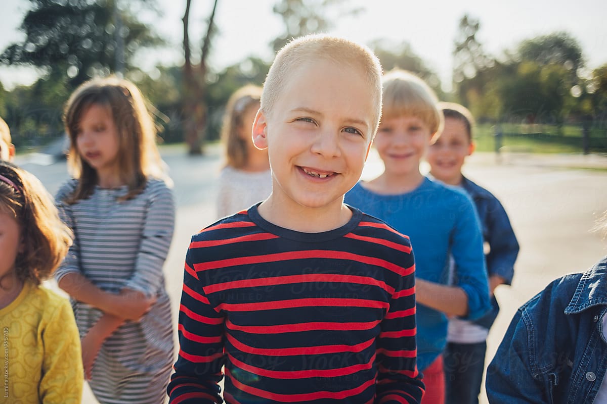 "Group Of Kids Playing Outdoors" by Stocksy Contributor "Lumina" - Stocksy