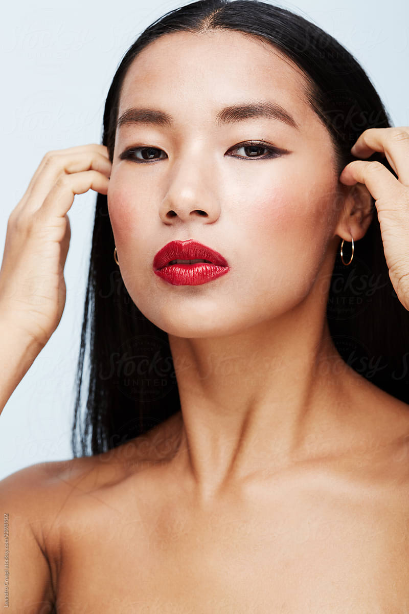 "Woman With Red Lips" by Stocksy Contributor "Ohlamour Studio" - Stocksy