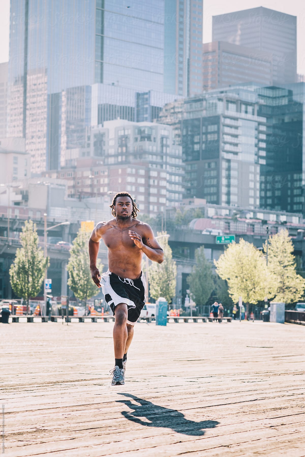 "Male Athlete Running In An Urban Area" by Stocksy Contributor "Take A ...