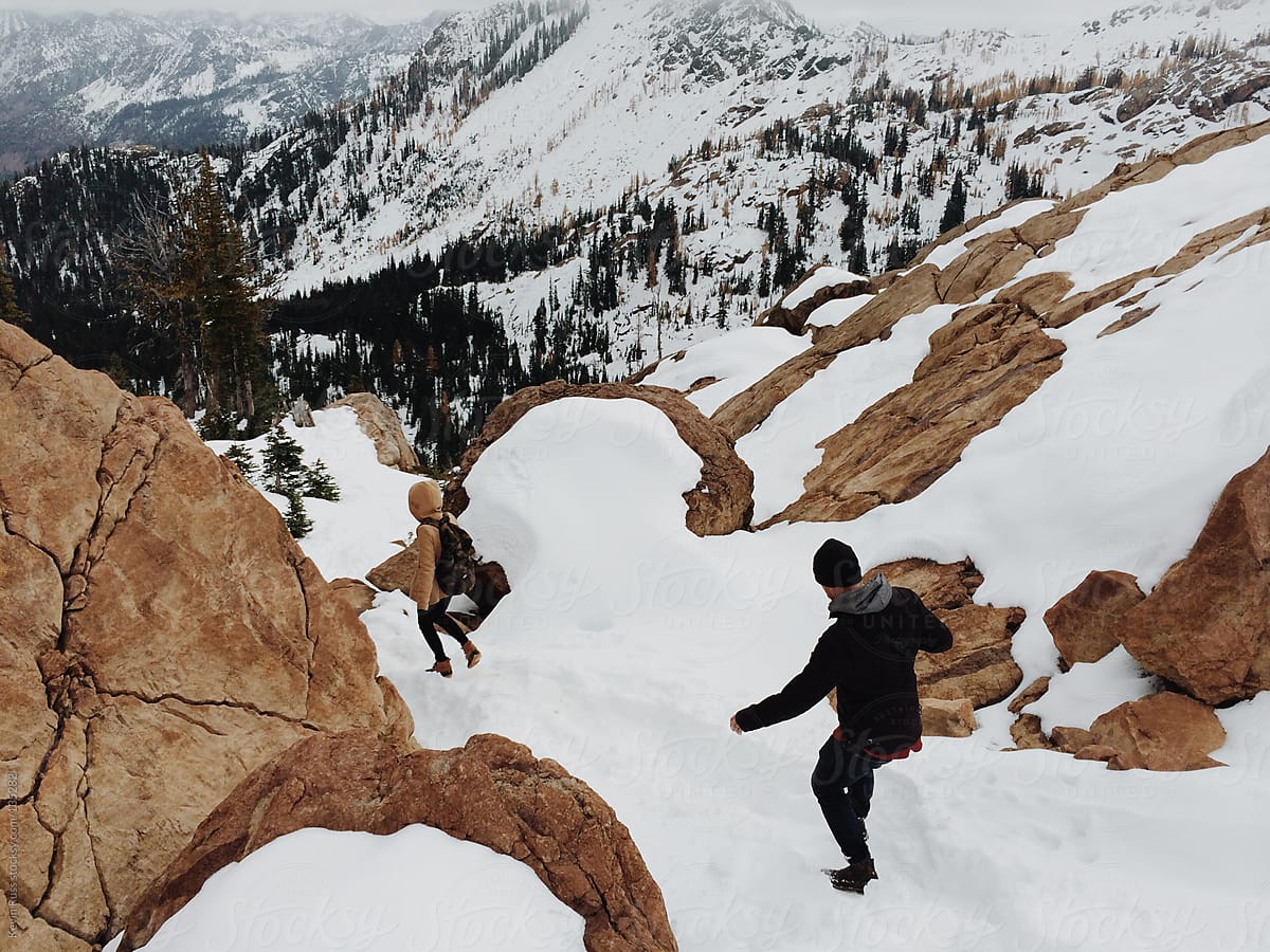 "Man And Woman Hiking Down A Mountain" by Stocksy Contributor "Kevin ...