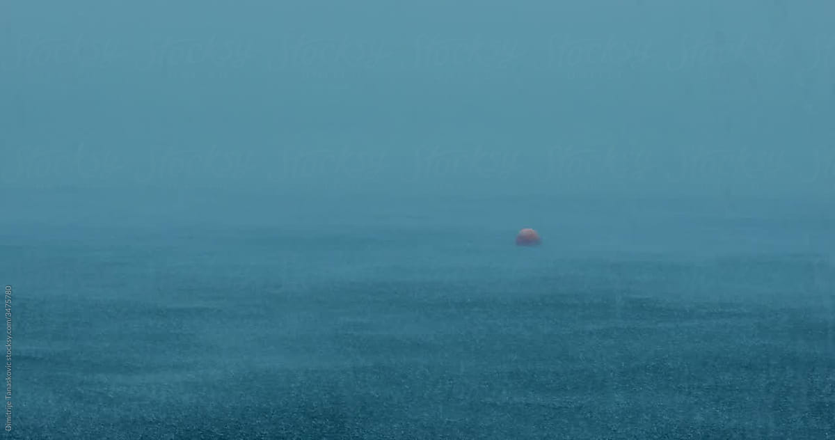"Heavy Rain Shower Over The Sea Surface." by Stocksy Contributor ...