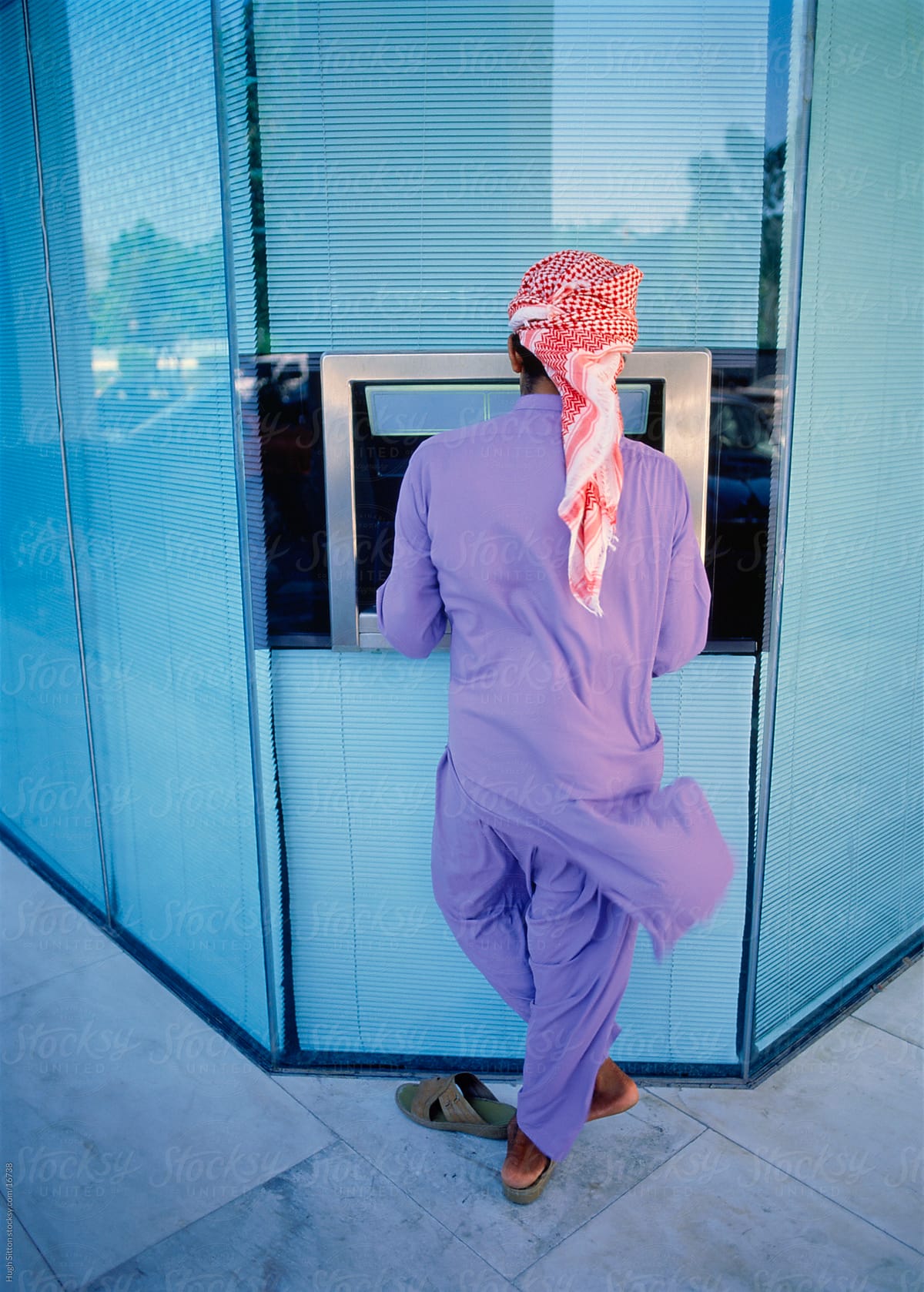 "Arab Businessman Using Cash Machine. Dubai. UAE" by Stocksy ...