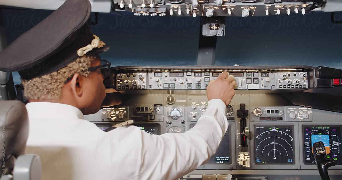 "Pilots Using Control Panel In Airplane Cockpit" by Stocksy Contributor ...
