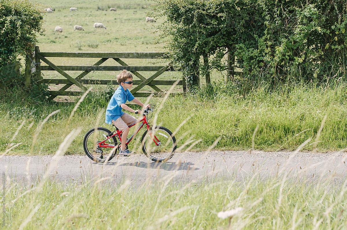 "Boy Cycling In English Countryside" by Stocksy Contributor "Rebecca ...