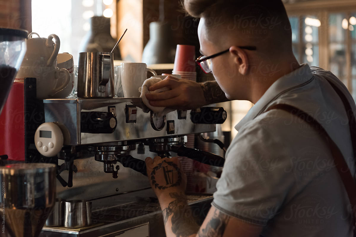 "Tattooed Barista Working With Machine" by Stocksy Contributor "Milles ...