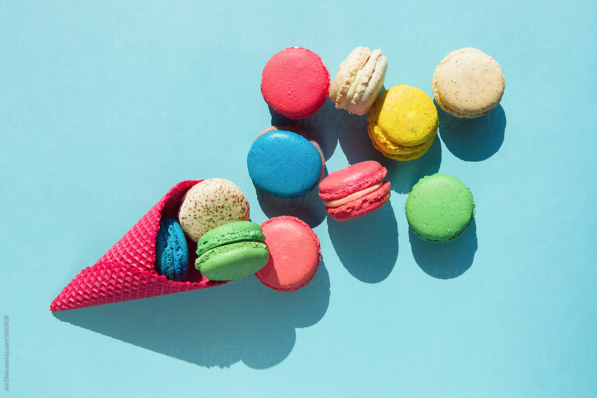 "Ice Cream Cone And Macaroons" by Stocksy Contributor "Ani Dimi" - Stocksy