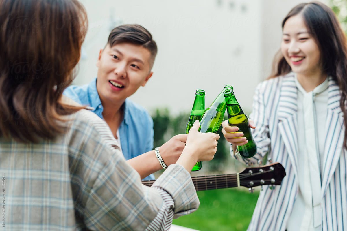 "Friends With Acoustic Guitar Singing And Drinking Beer" by Stocksy ...