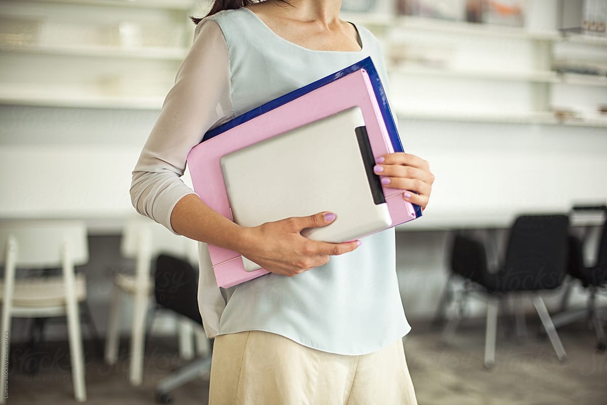"Businesswoman Holding Files And A Tablet" by Stocksy Contributor ...