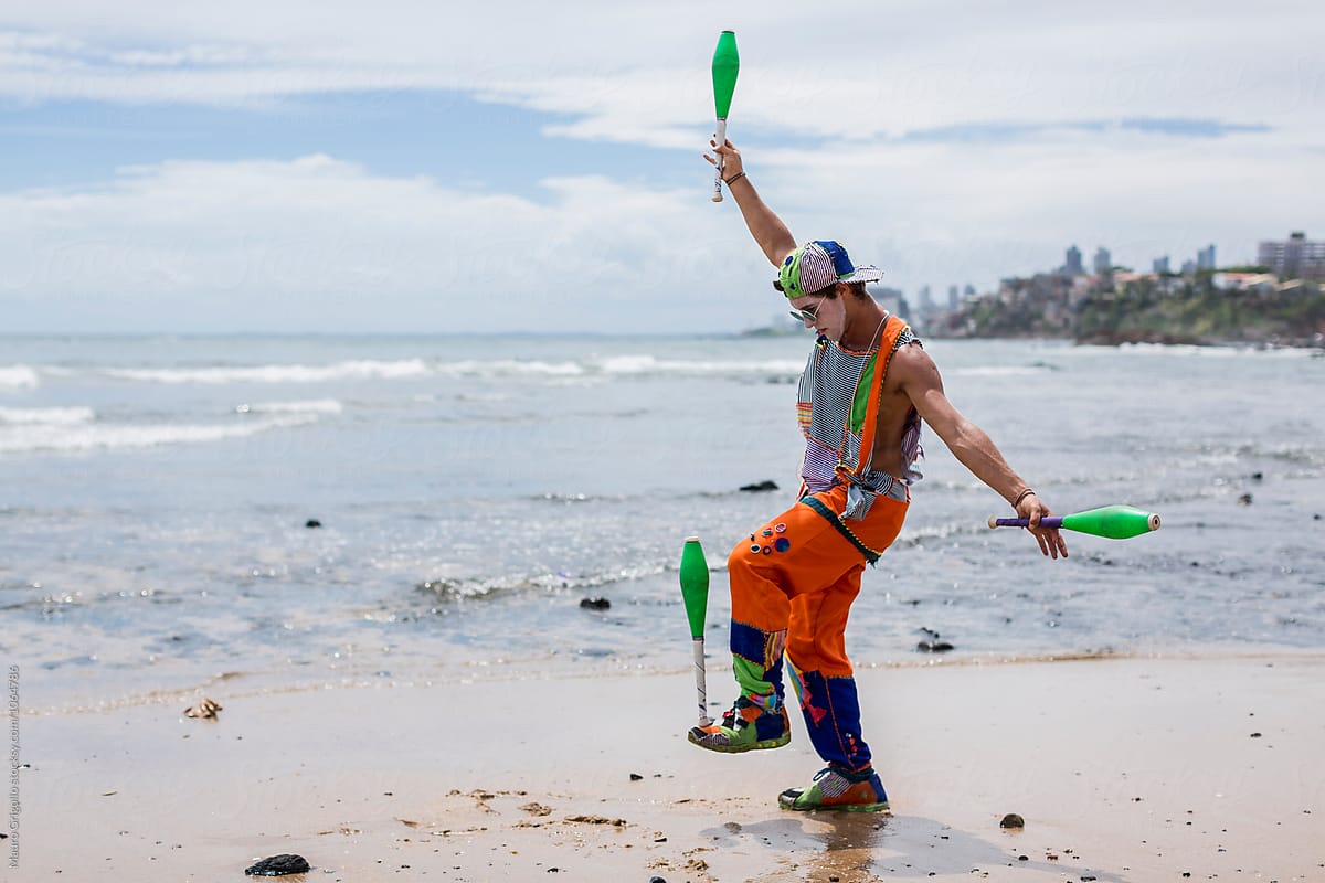 "Circus Performer Juggling On The Beach." by Stocksy Contributor "Mauro ...