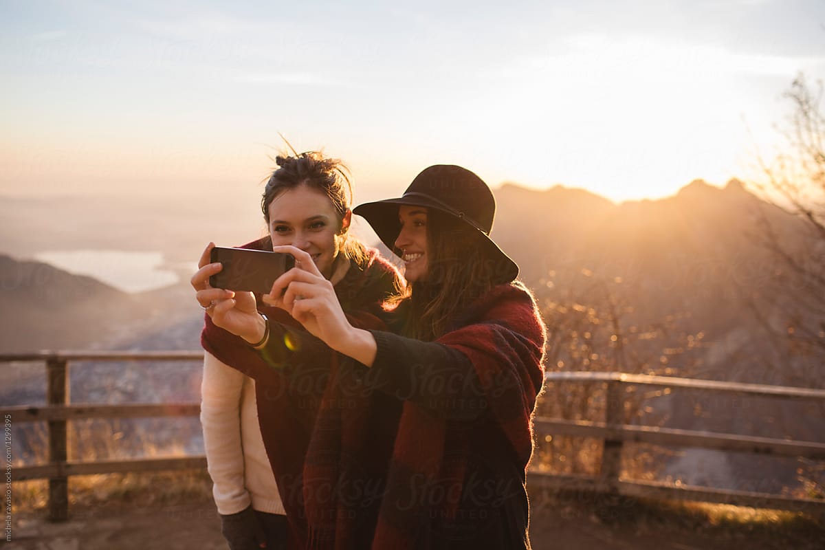 "Girls Taking A Selfie At Sunset" by Stocksy Contributor "Michela ...