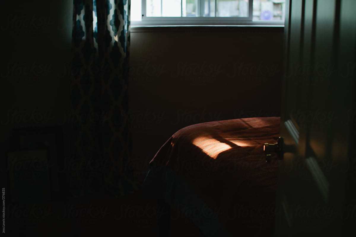 "Sunlight On Bed In Darkened Bedroom" by Stocksy Contributor "Jess ...