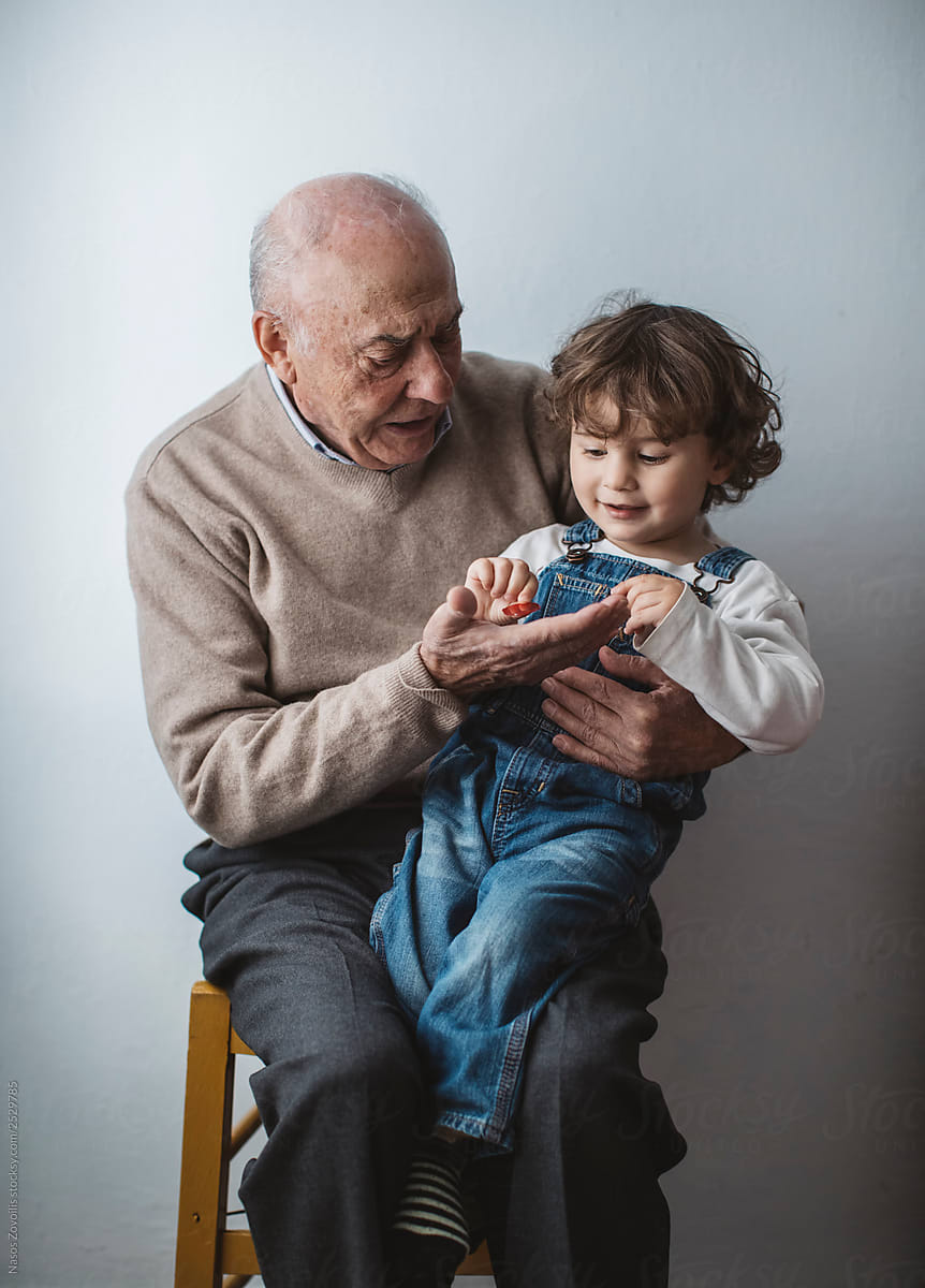 "Grandfather Talking To His Grandson Indoor" by Stocksy Contributor ...