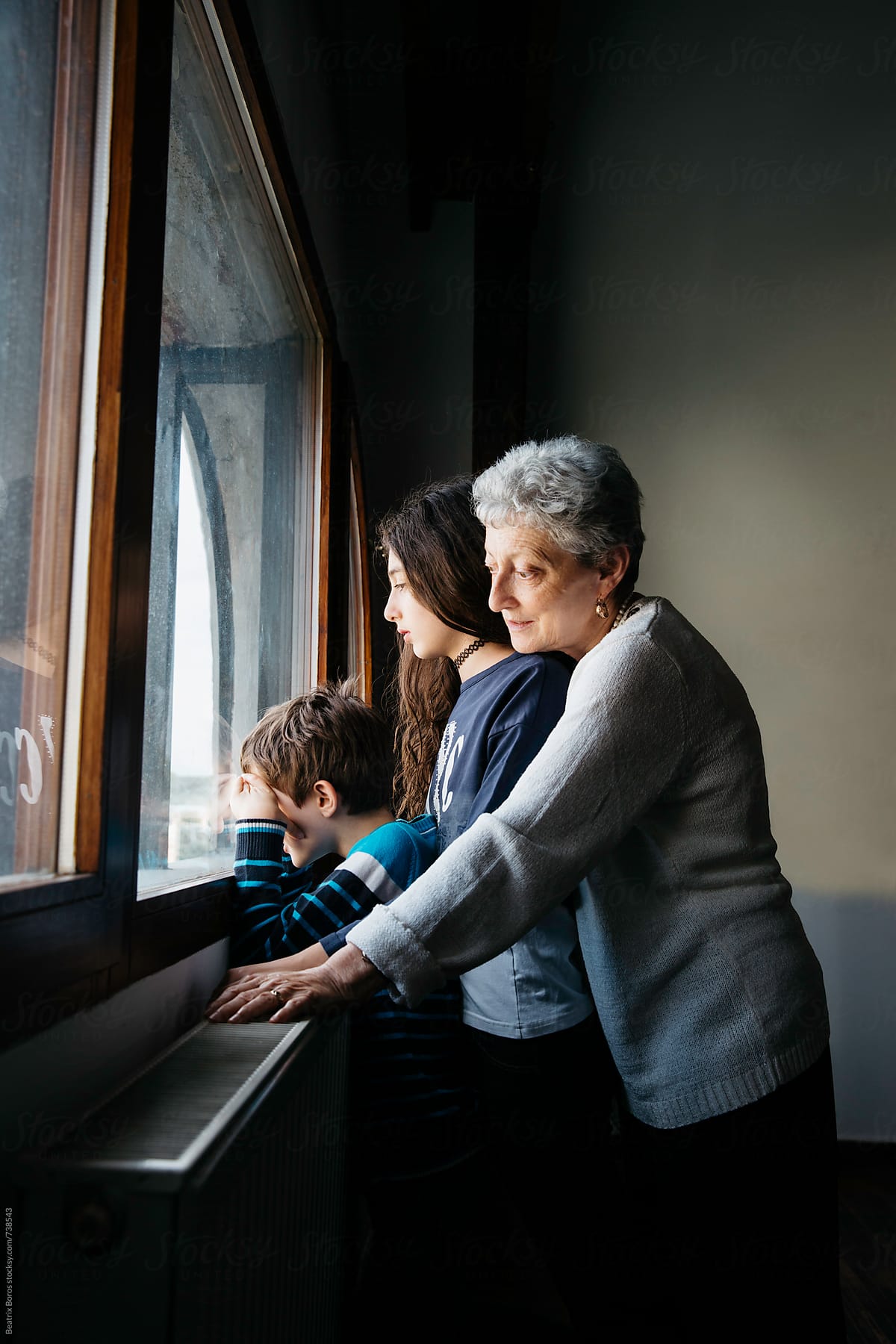 "Two Kids Waiting By The Window Together With Grandma" by Stocksy ...
