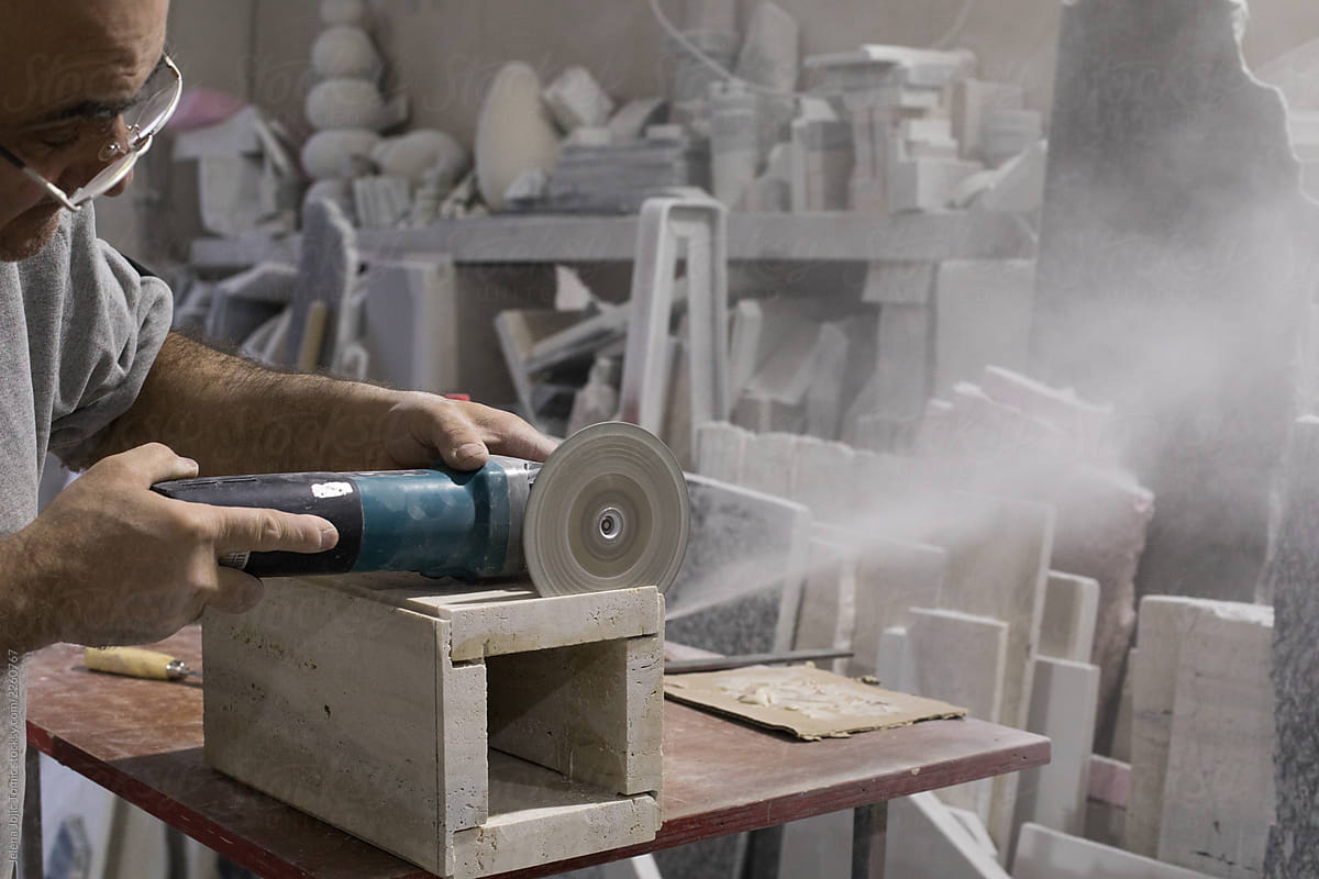 "Man Cuts A Piece Of Stone With A Grinder" by Stocksy Contributor ...