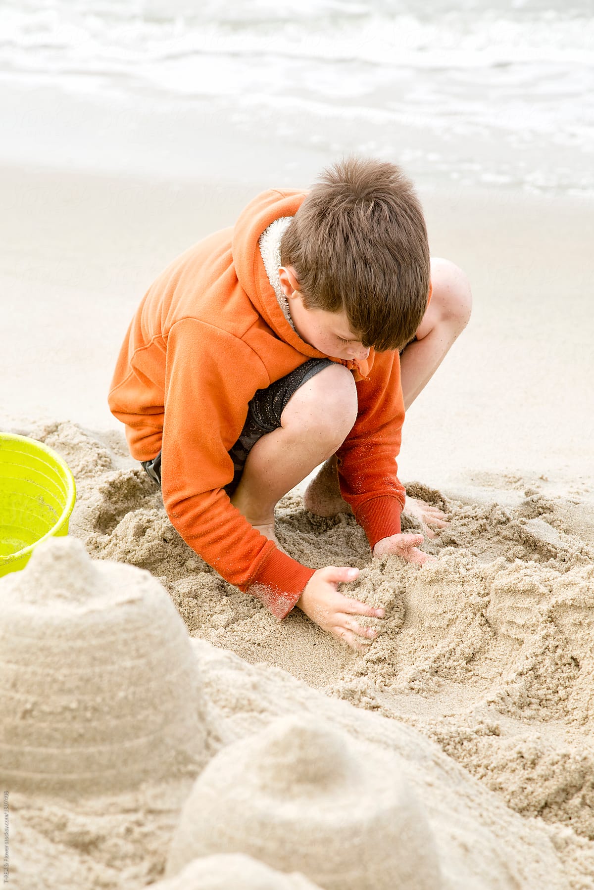 "Young Boy Building Sandcastle" by Stocksy Contributor "Danil Nevsky ...