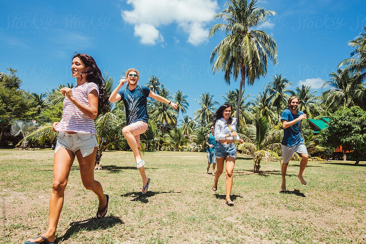 "Group Of Happy People Running" by Stocksy Contributor "Lumina" - Stocksy