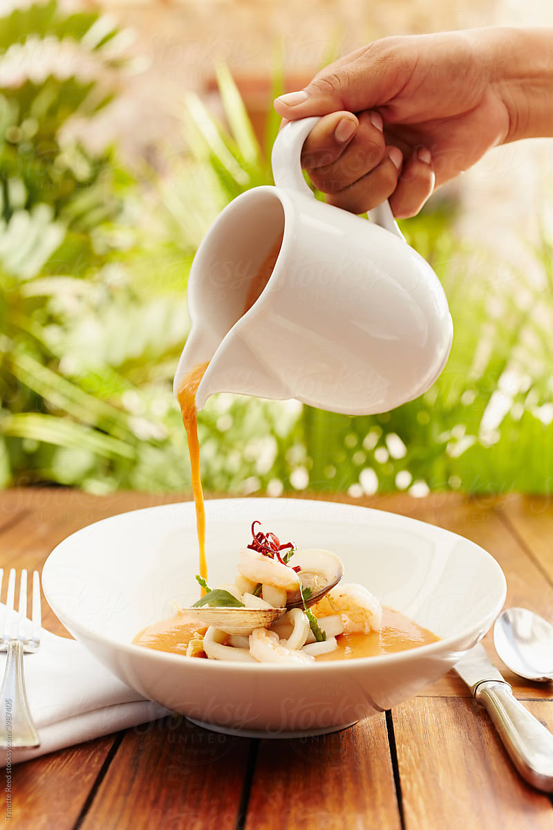 "Server Pouring Seafood Soup At Tropical Restaurant" by Stocksy ...