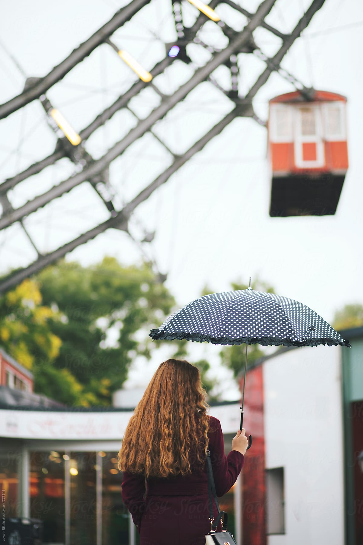 "Back View Of A Young Woman Holding Umbrella" by Stocksy Contributor ...