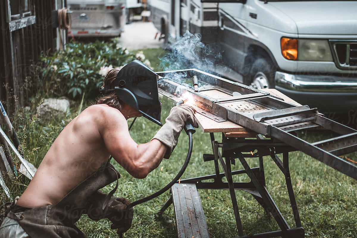 "Man Welding A Ladder" by Stocksy Contributor "Akela - from alp to alp ...