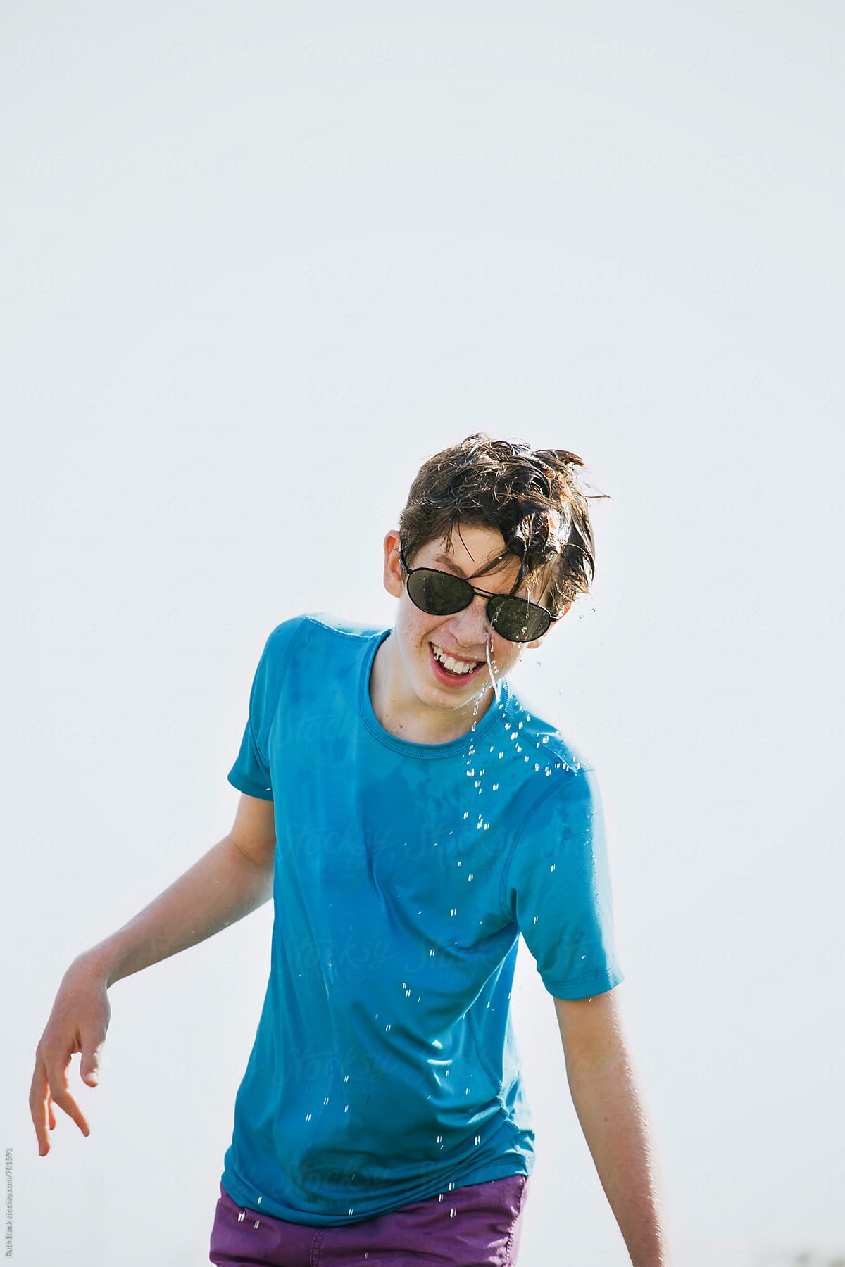 "Boy Playing With Water Balloons" by Stocksy Contributor "Ruth Black ...