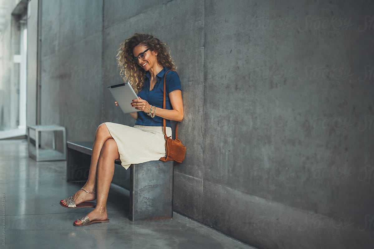 "Woman Sitting In A Hallway" by Stocksy Contributor "Studio Firma ...