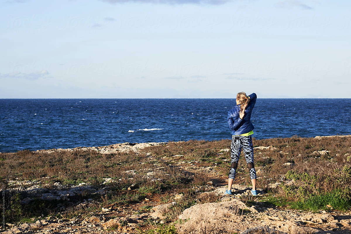 "Faceless Fit Woman Stretching Against Sea." by Stocksy Contributor ...