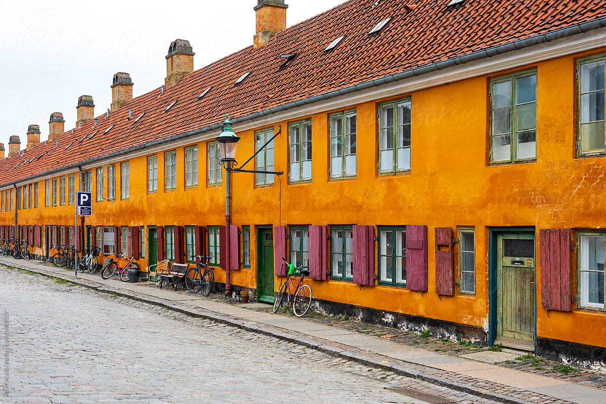 "Orange Home Building In Copenhagen" by Stocksy Contributor "MEM Studio ...