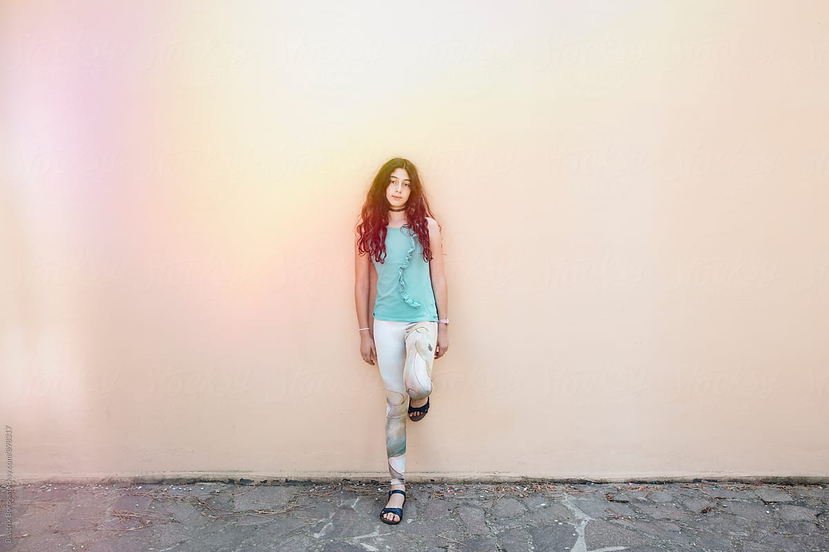 "Pre-teenager Girl Standing In Front Of A Wall" by Stocksy Contributor ...