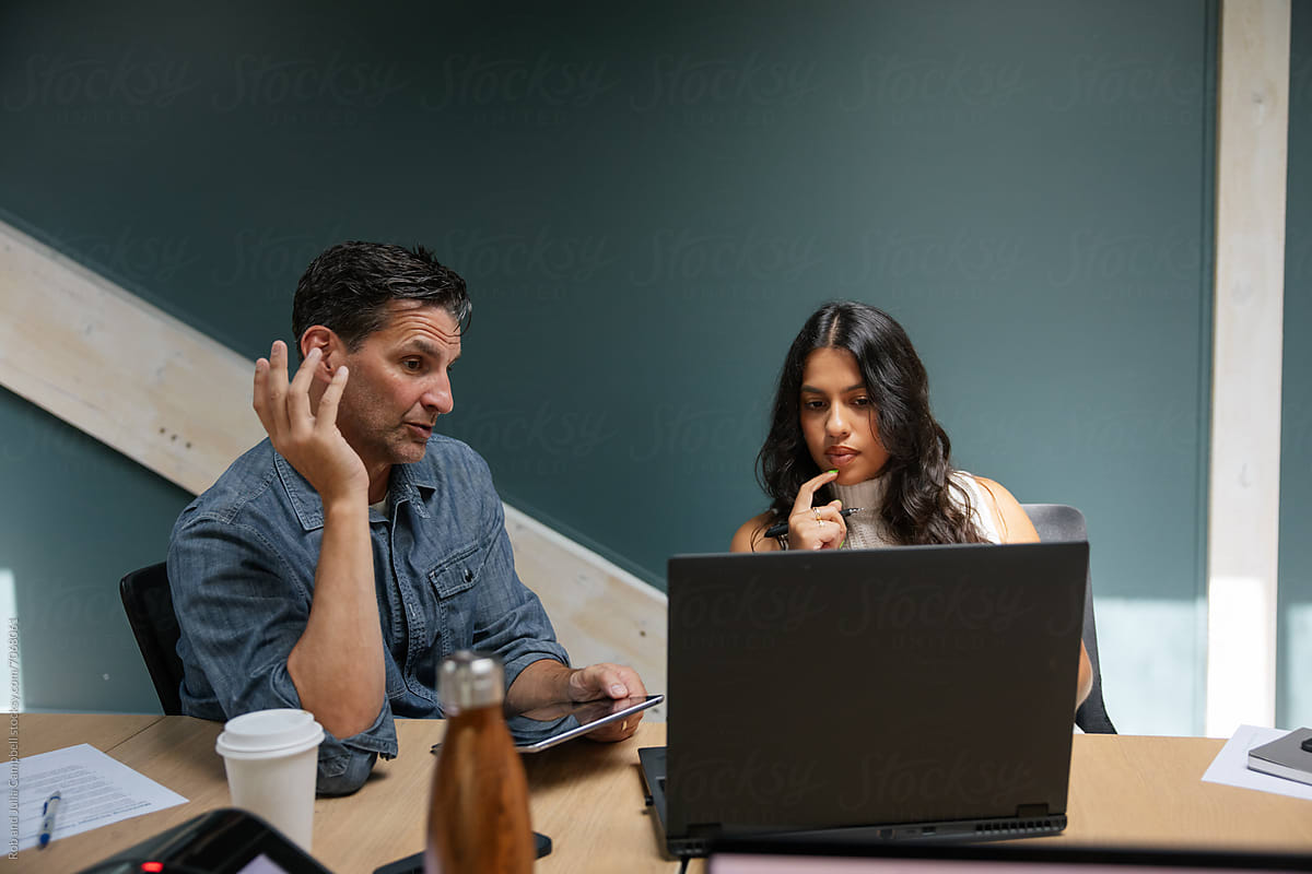 "Two Colleagues Discussing Project Details During A Collaborative Chat ...