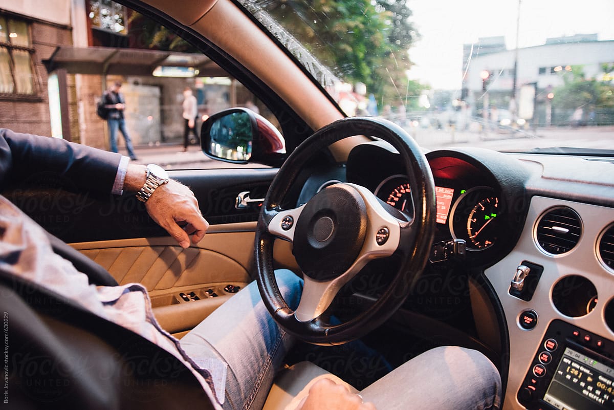 "Businessman Driving A Luxurious Car" by Stocksy Contributor "Boris ...