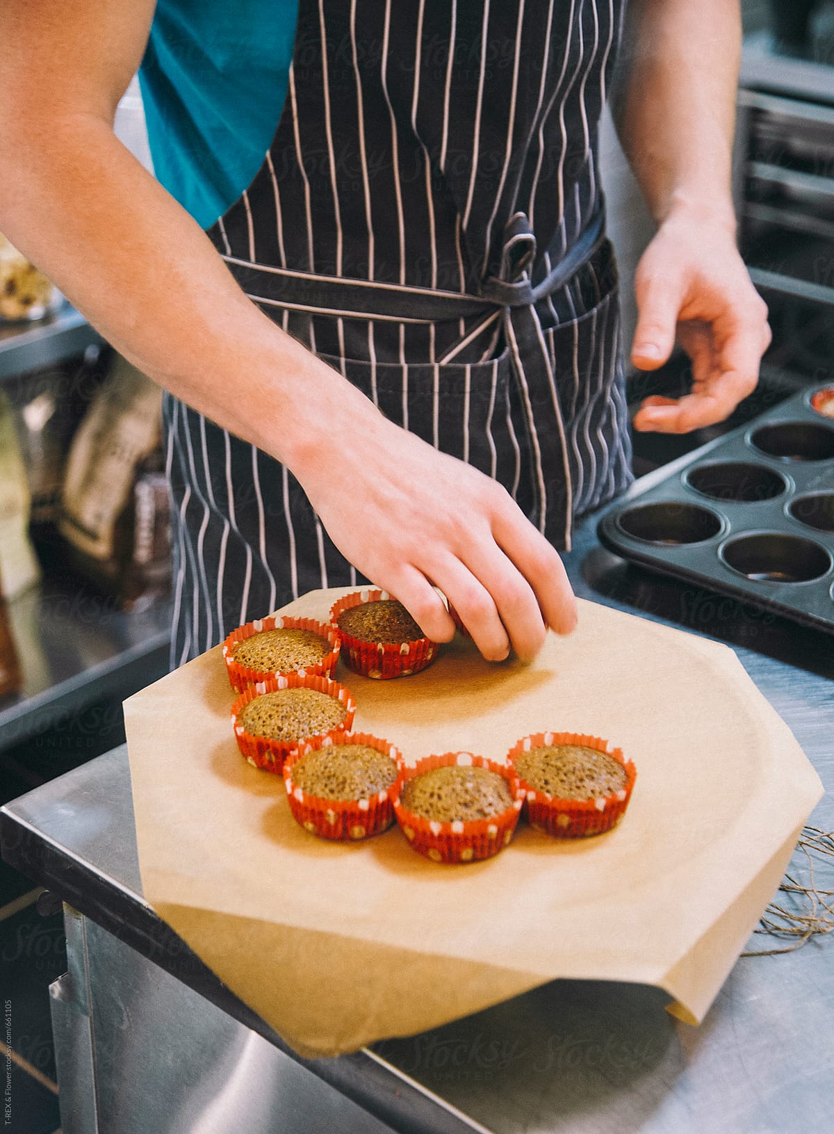 "Cook Puts Cakes" by Stocksy Contributor "Danil Nevsky" - Stocksy